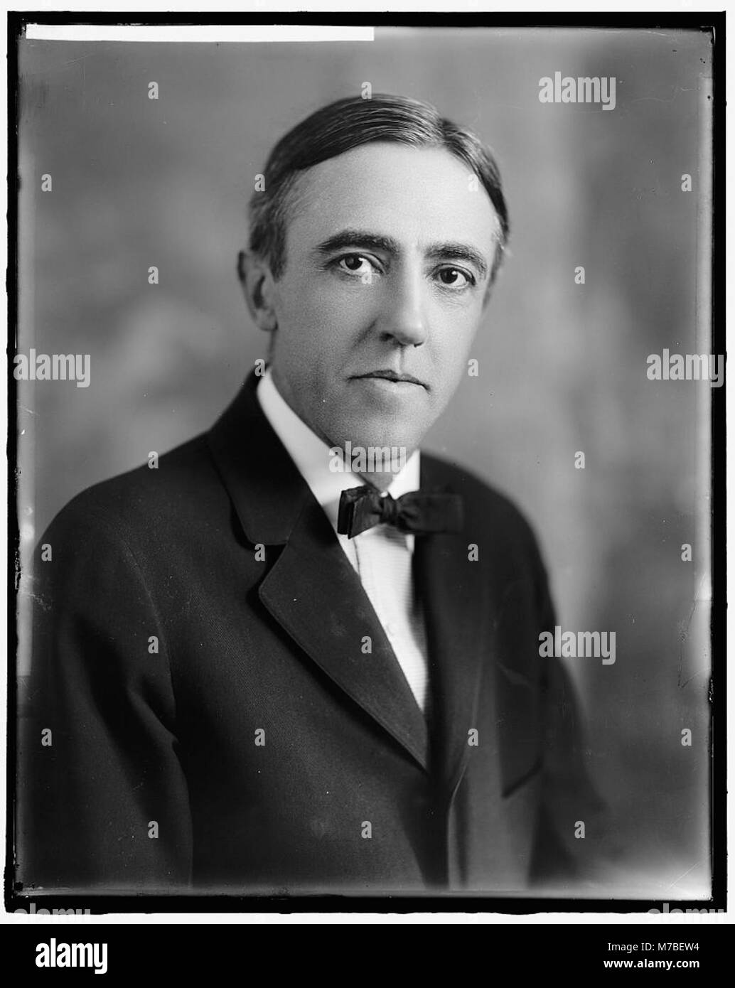 A formal portrait of Stanley E. Bowdle, a representative, capturing his ...