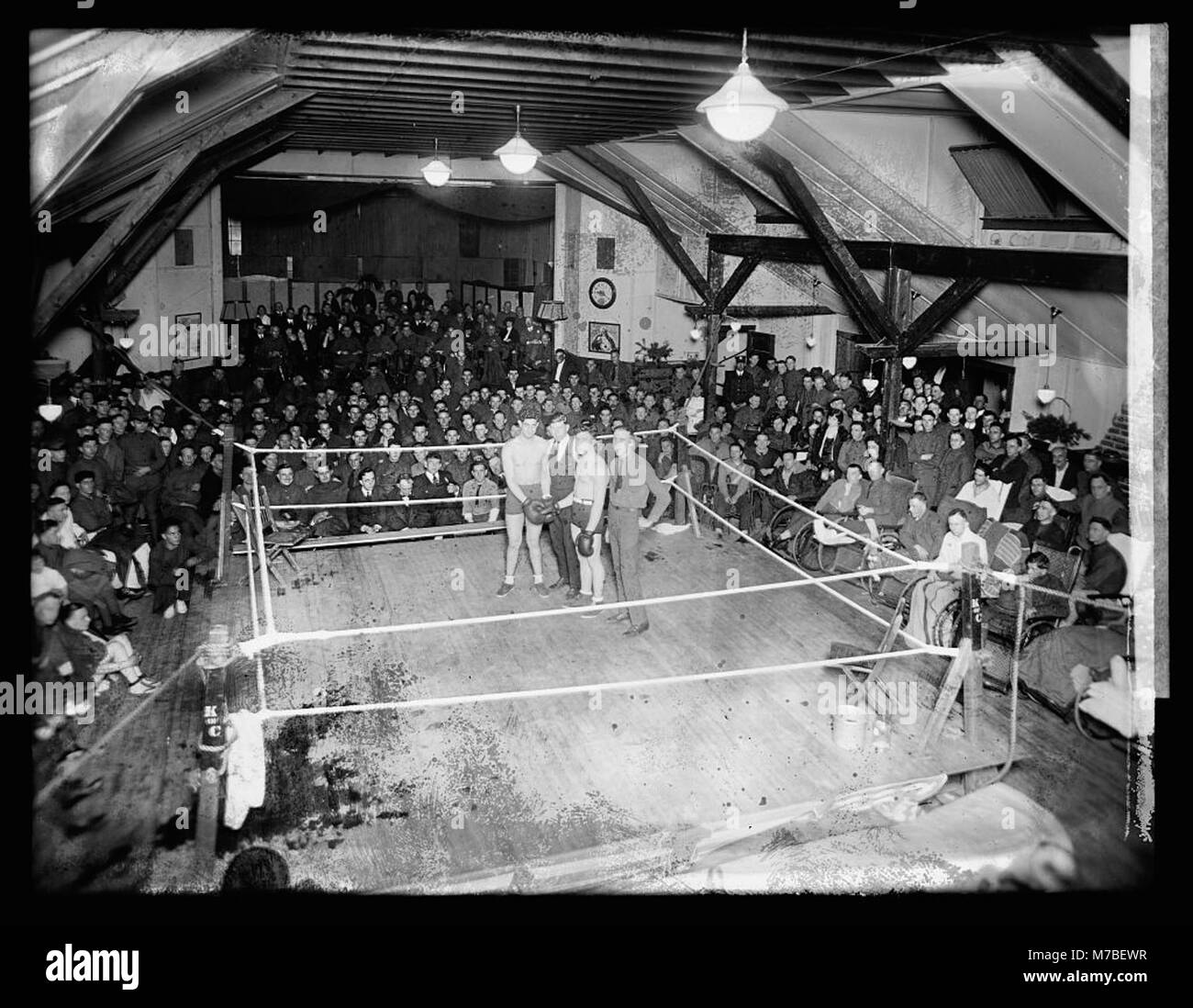 A photograph featuring boxing at Walter Reed, possibly a boxing match ...