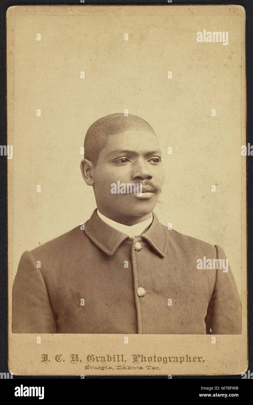 A Buffalo Soldier is photographed in his five-button sack coat, a ...