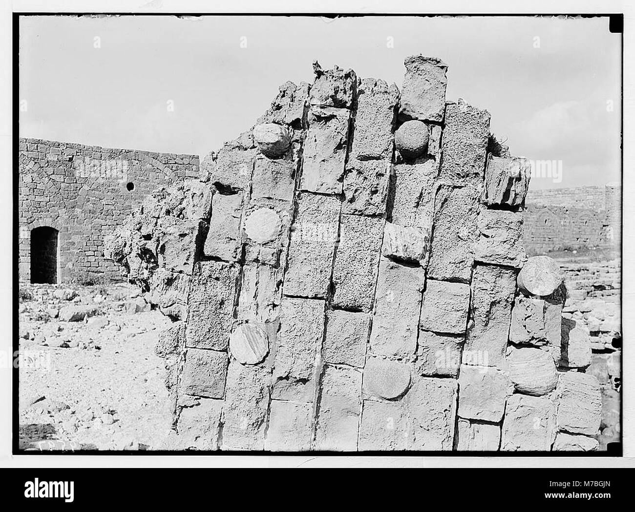This image presents a close-up view of a fallen section of wall at the ...