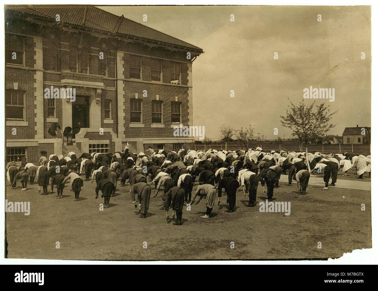 This photograph depicts a daily calisthenics routine in Lawton schools ...