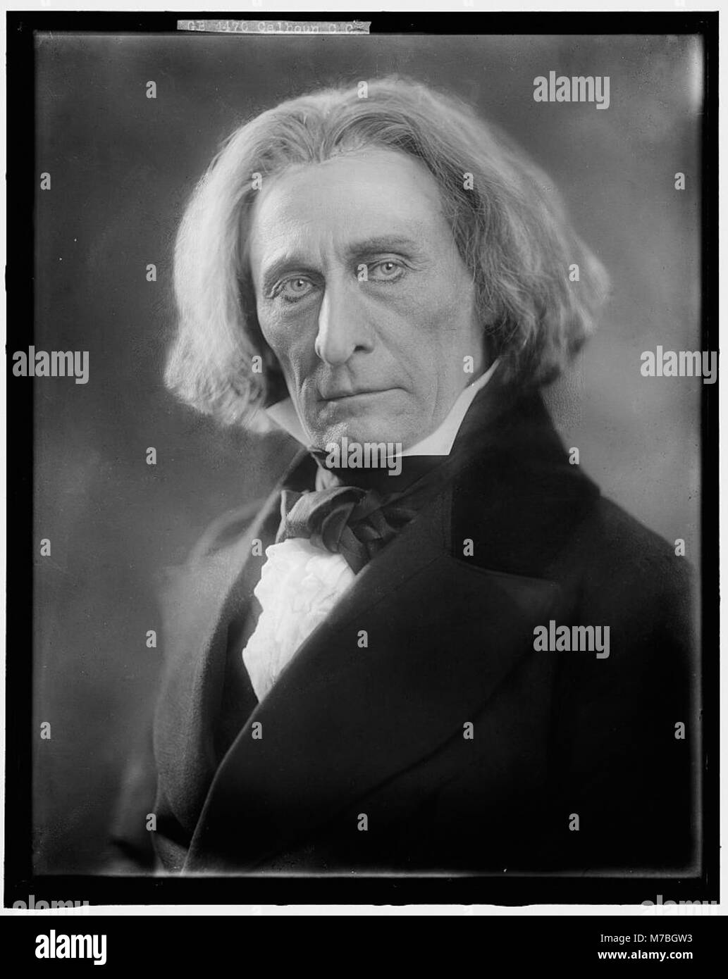 A portrait of C.C. Calhoun, captured in a formal setting. The image ...