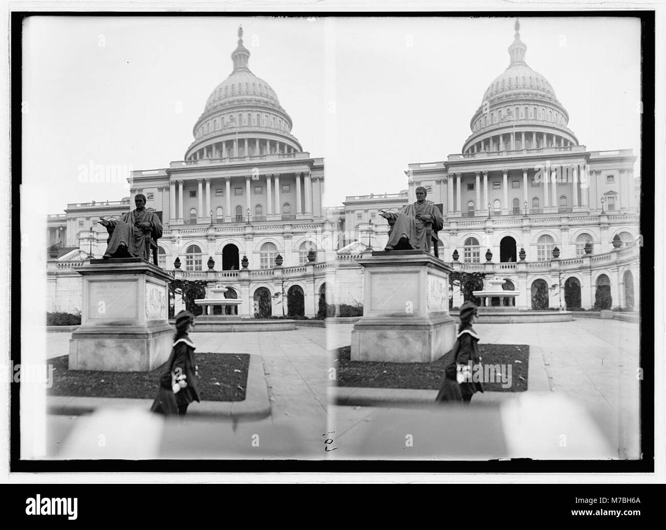 A photograph of the U.S. Capitol Building and the John Marshall statue ...