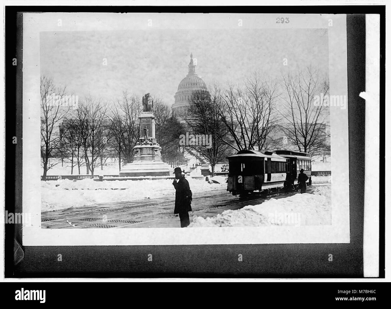 A winter scene showing the Capitol building and the Peace Monument ...