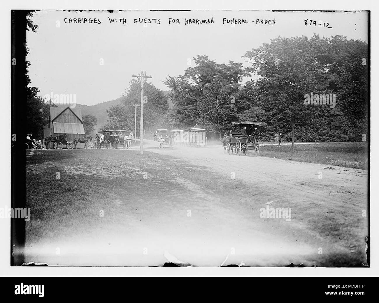 A historical photograph showing carriages with guests arriving at the ...