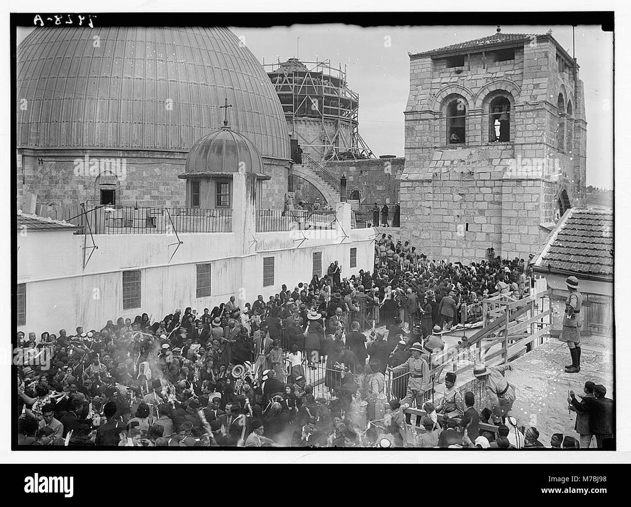 The photograph depicts the annual Ceremony of the Holy Fire on the roof ...