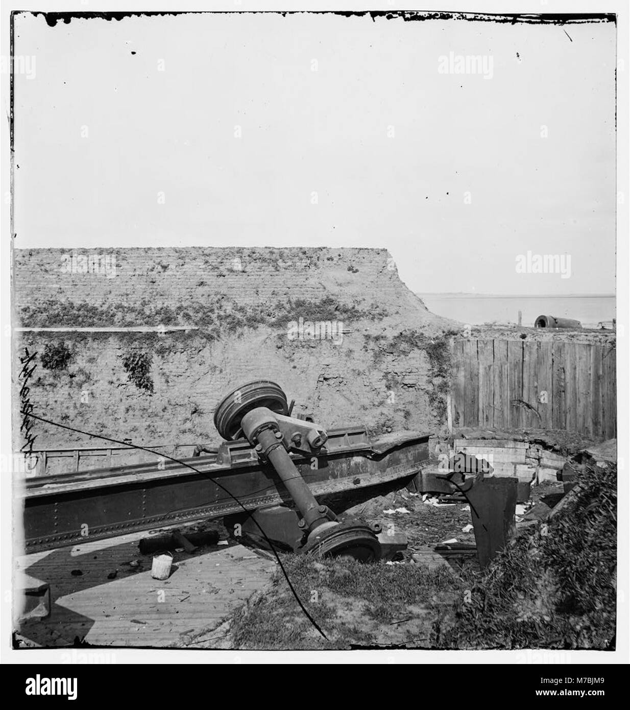 A photograph depicting the wrecked carriage of a Blakely gun battery in ...