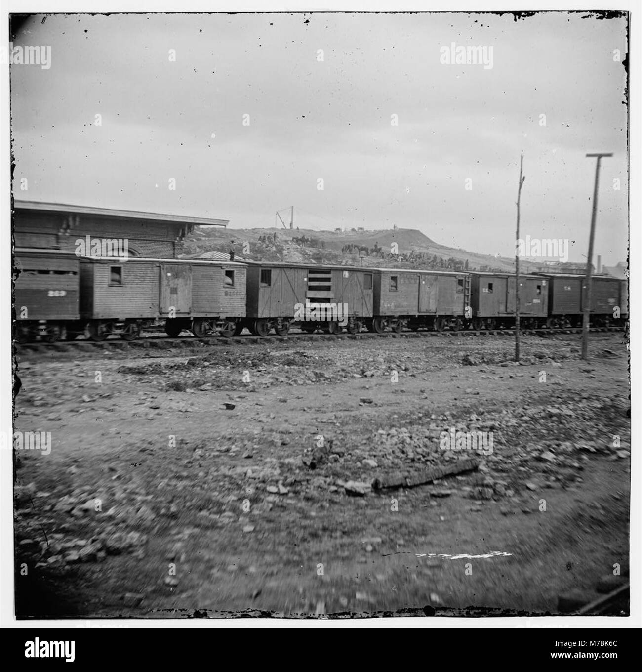 A photograph showing Federal cavalry troops guarding a railroad depot ...
