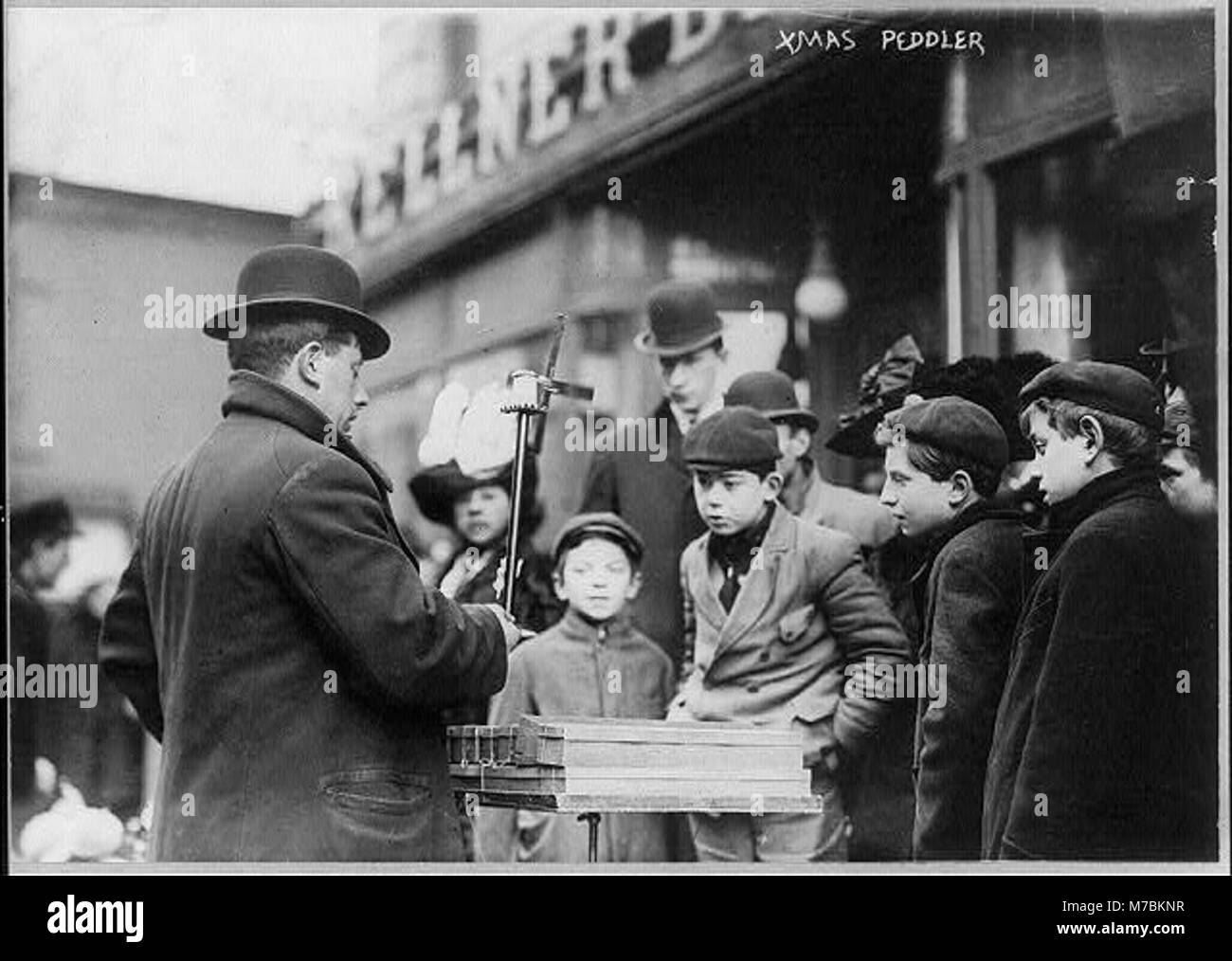A Christmas peddler on December 19, 1910, captured in a photograph ...