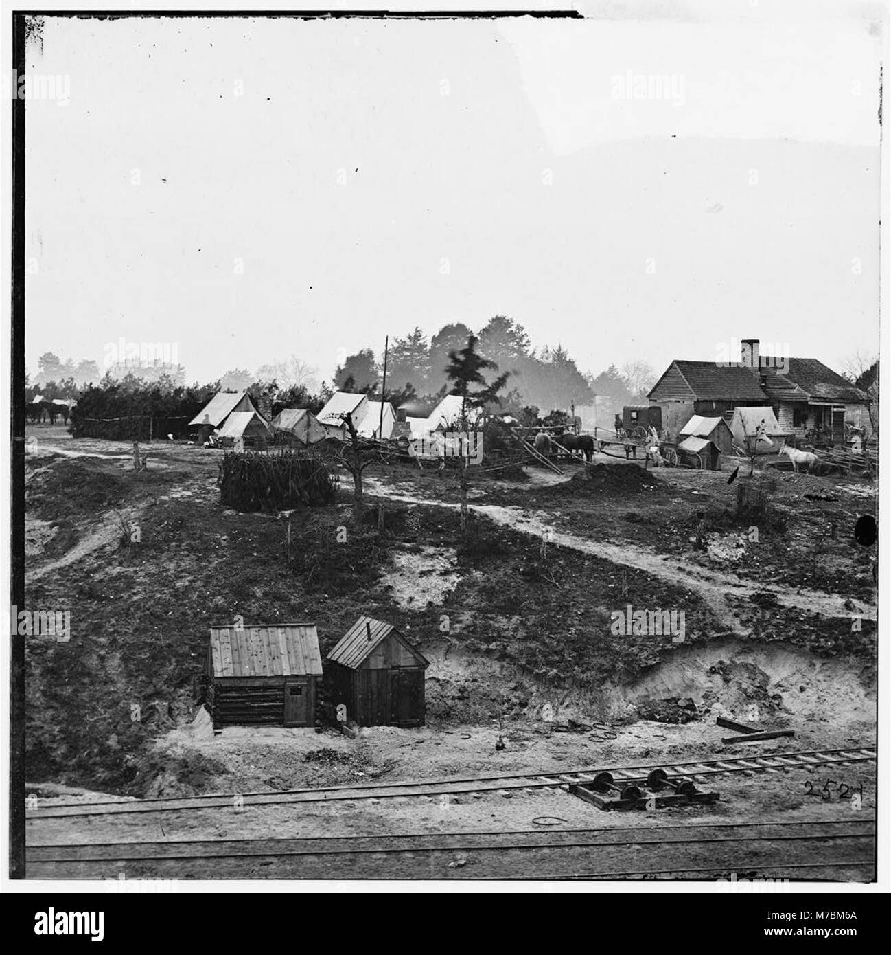 A historical photograph depicting a cavalry camp near City Point ...