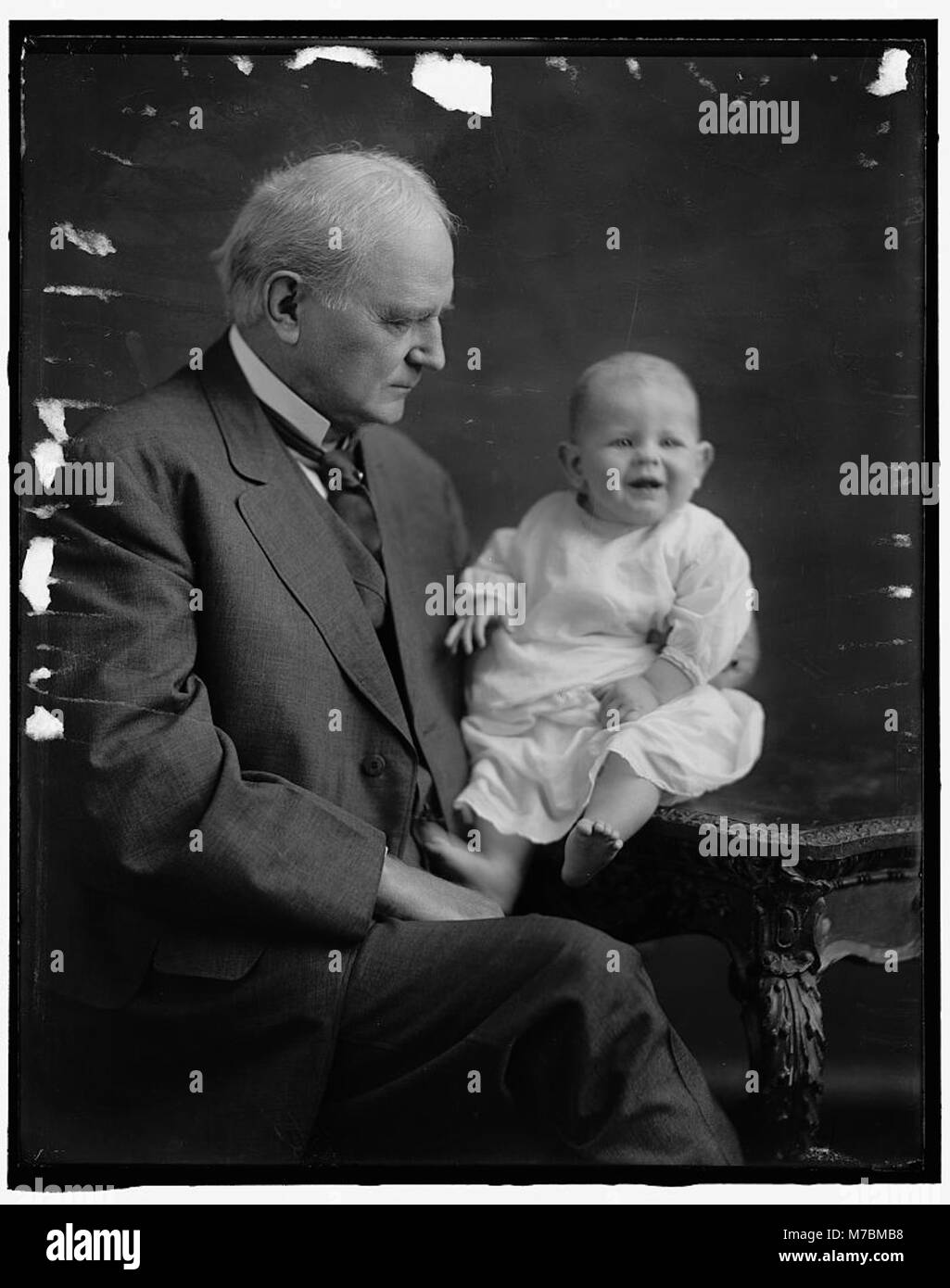 Champ Clark was photographed with a child. The image reflects a moment ...