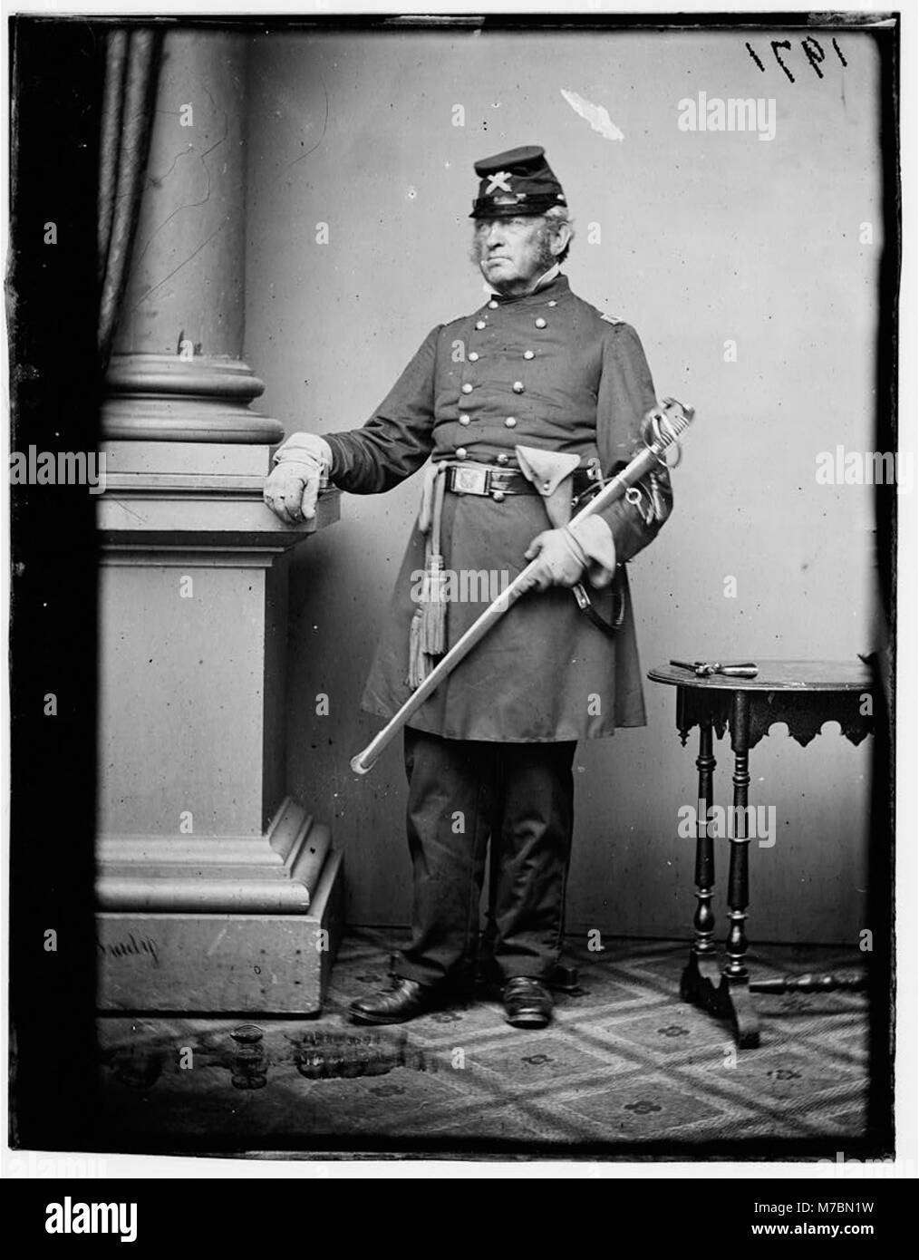 This image depicts Colonel J. Rikell, an officer in the military ...