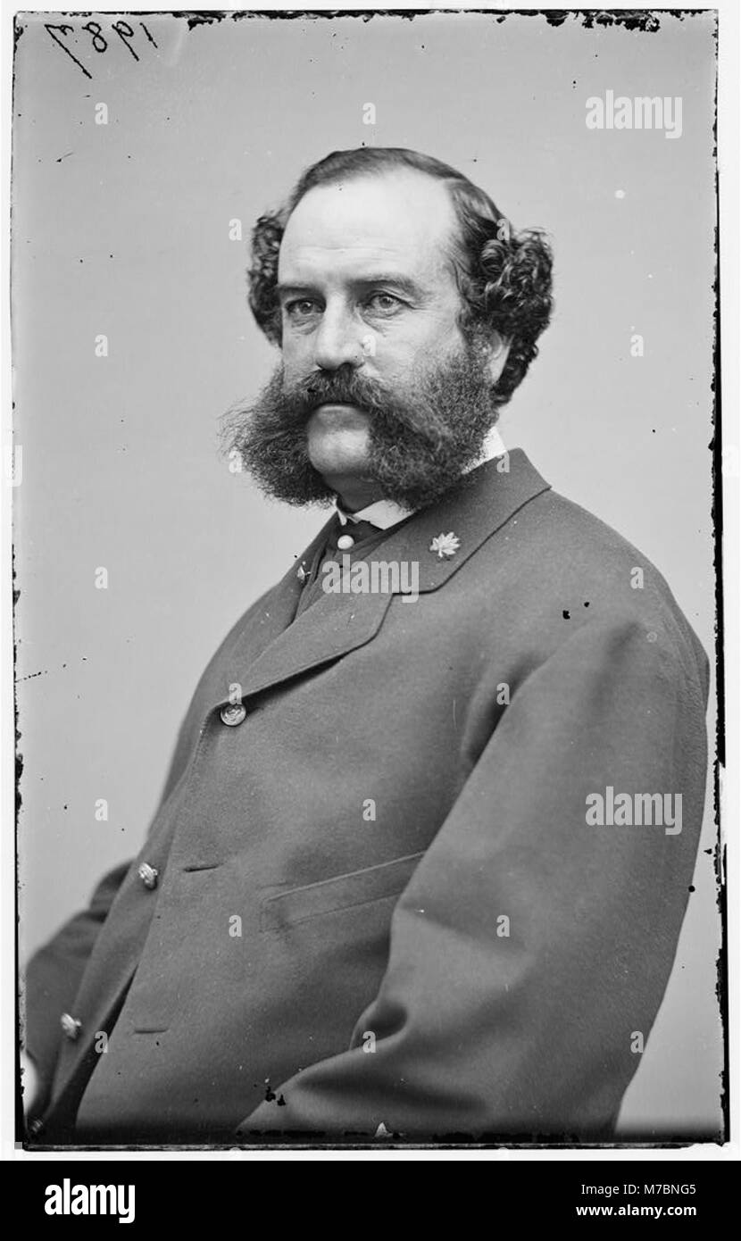 A portrait of Commander J.P. Barrett, likely from the military, showing ...