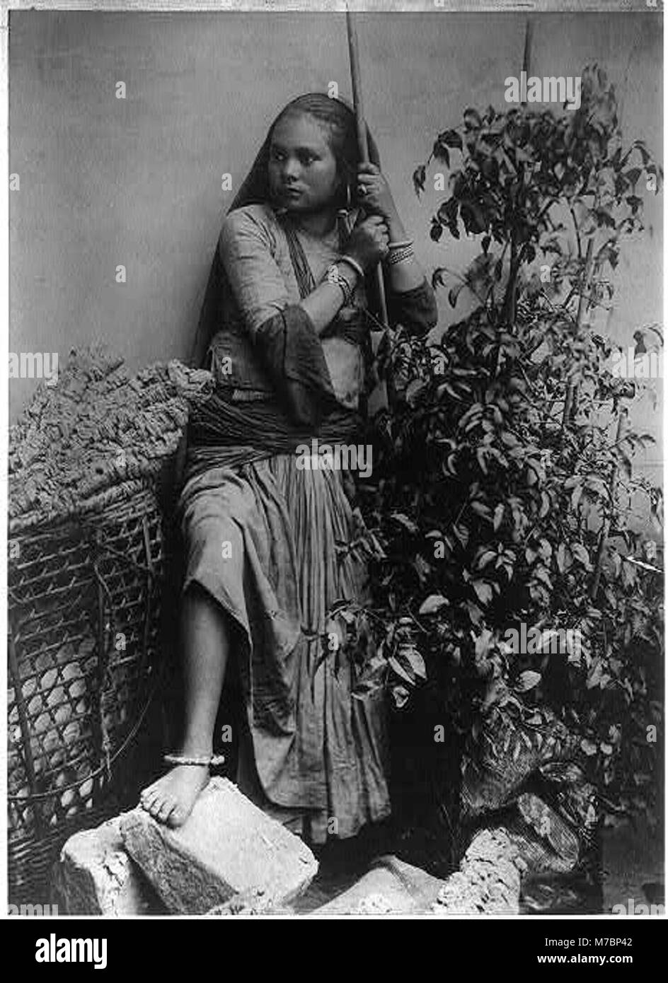 This photograph depicts a woman from Darjeeling, India, traditionally ...