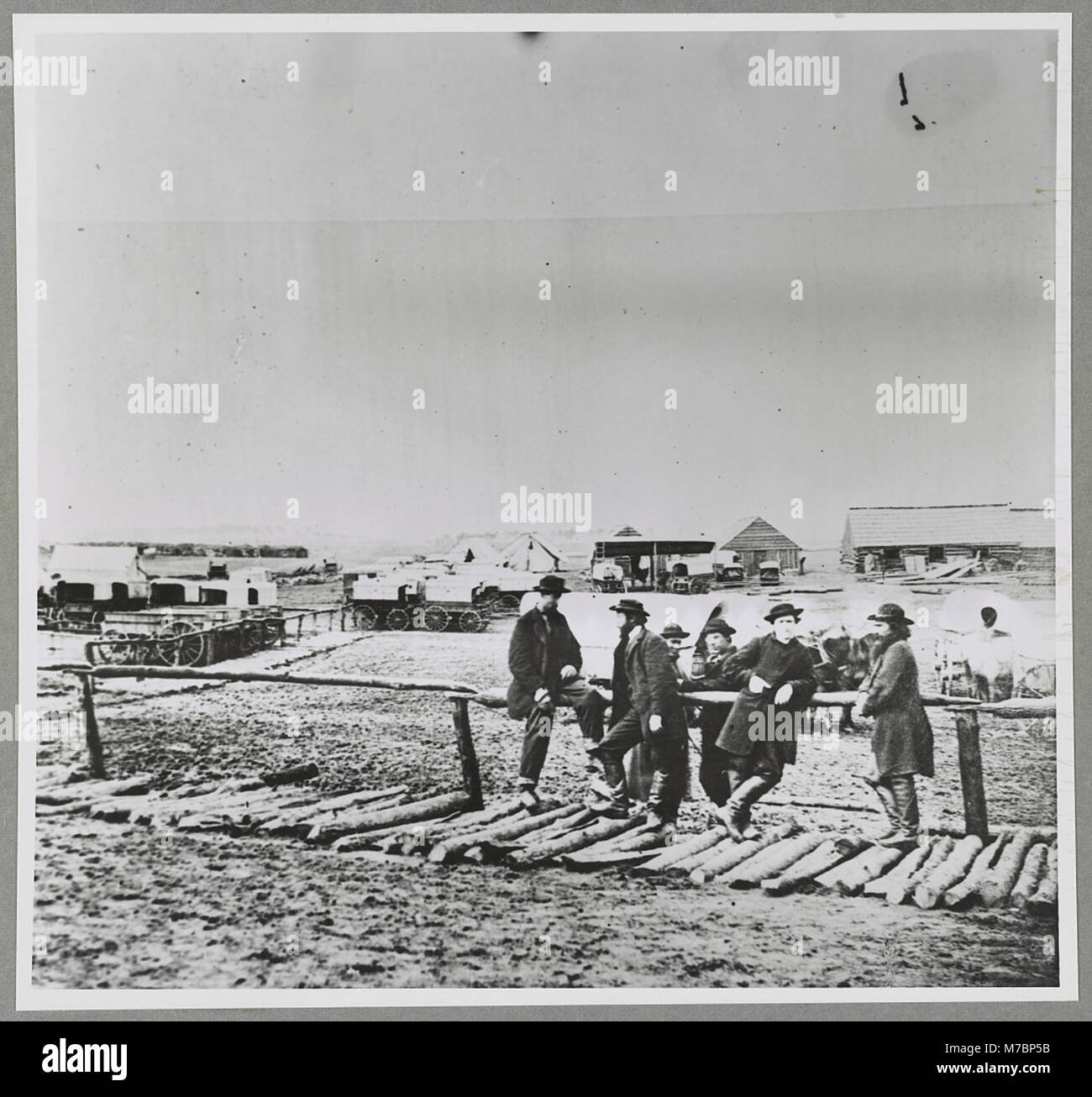 A historical photograph of a corduroy road, a type of road construction ...