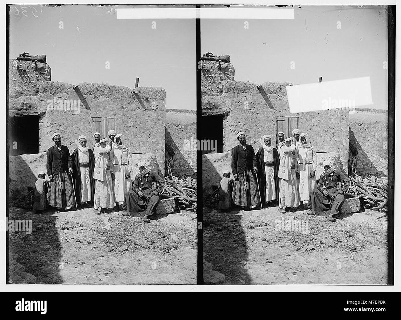 This photograph features a group of Druze men in traditional costumes ...