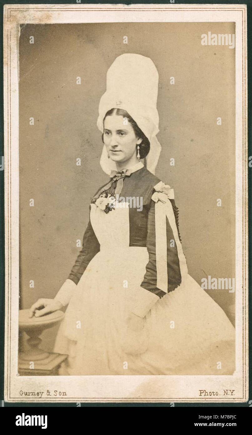 A detailed depiction of ladies' costumes at the Normandy stand during ...