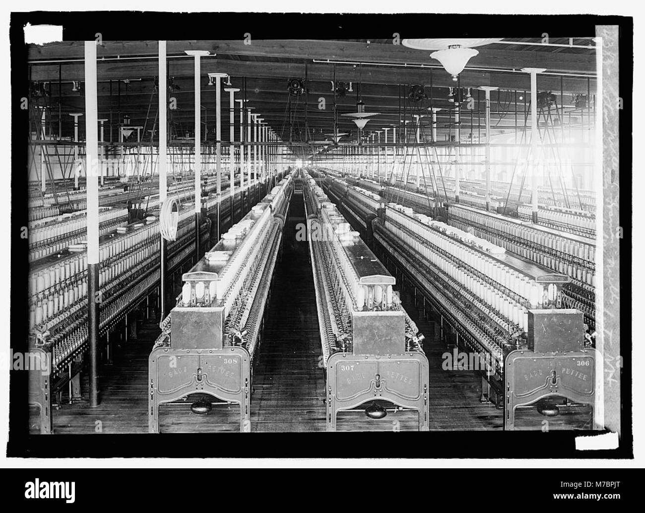 A photograph showing the spinning frames in the cotton mills at ...
