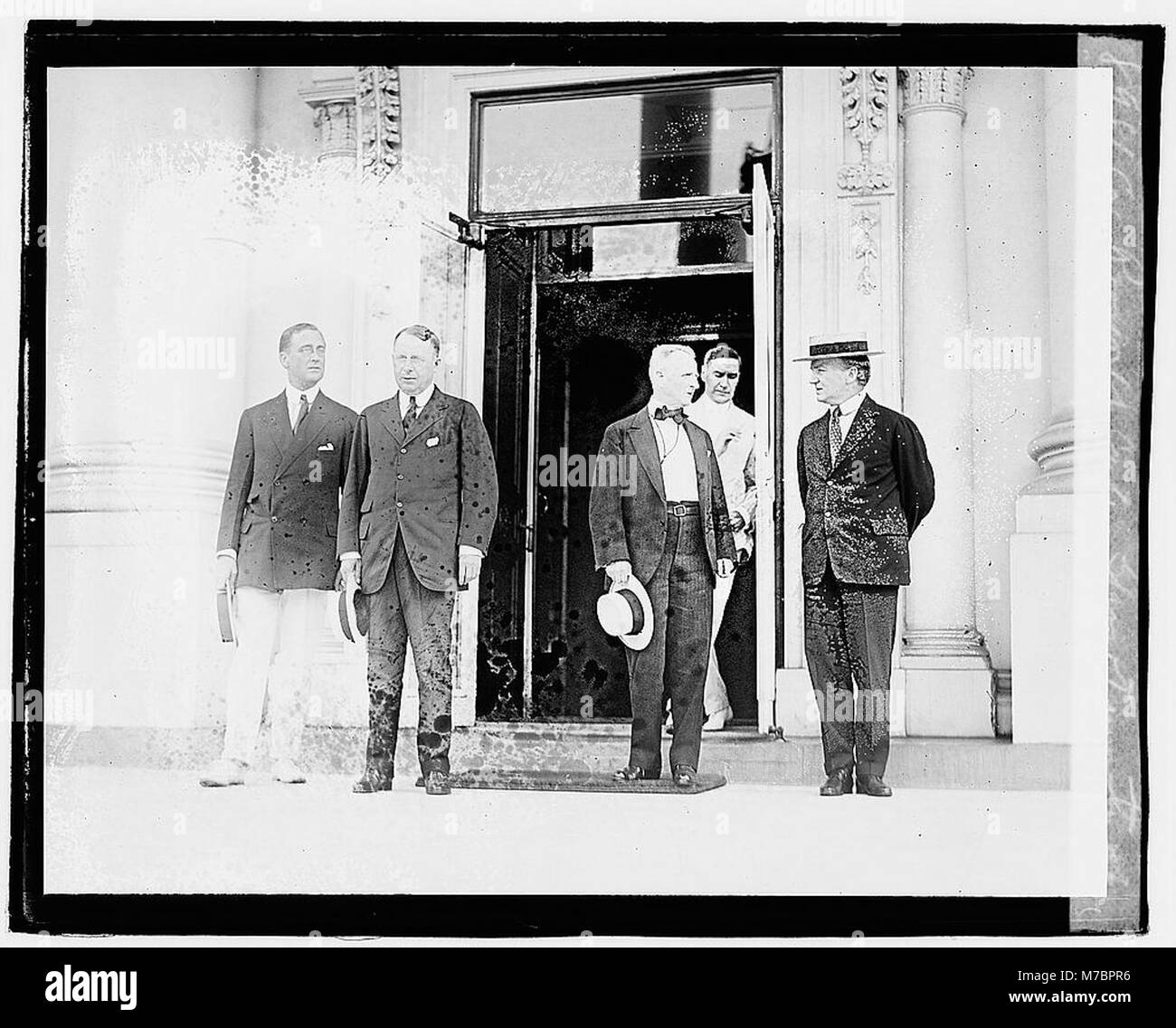 This historical photograph captures prominent figures including ...