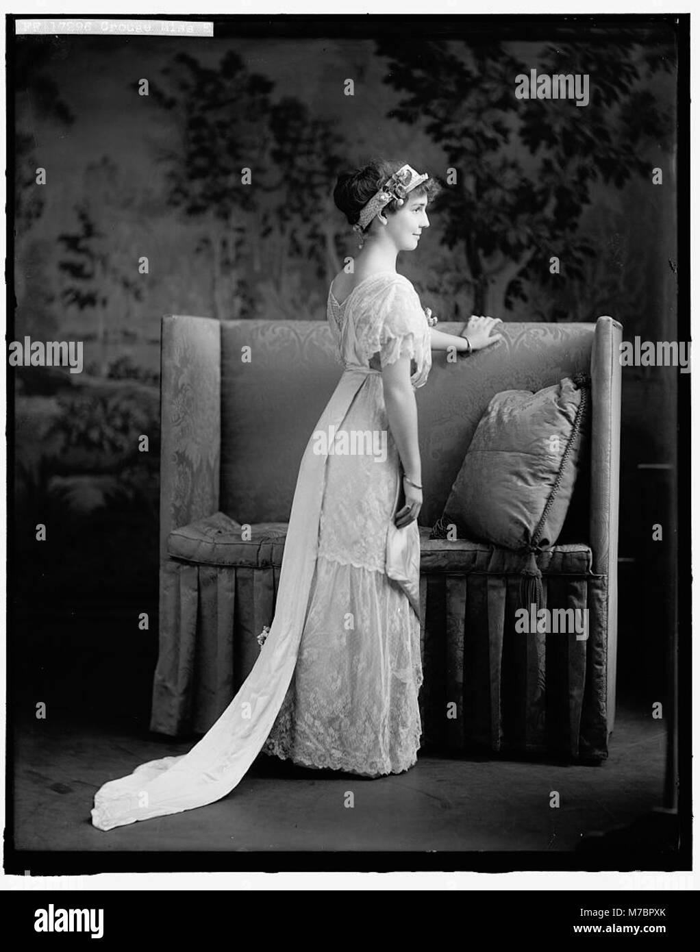 A portrait of Miss E. Crouse, captured in a formal pose. The image ...
