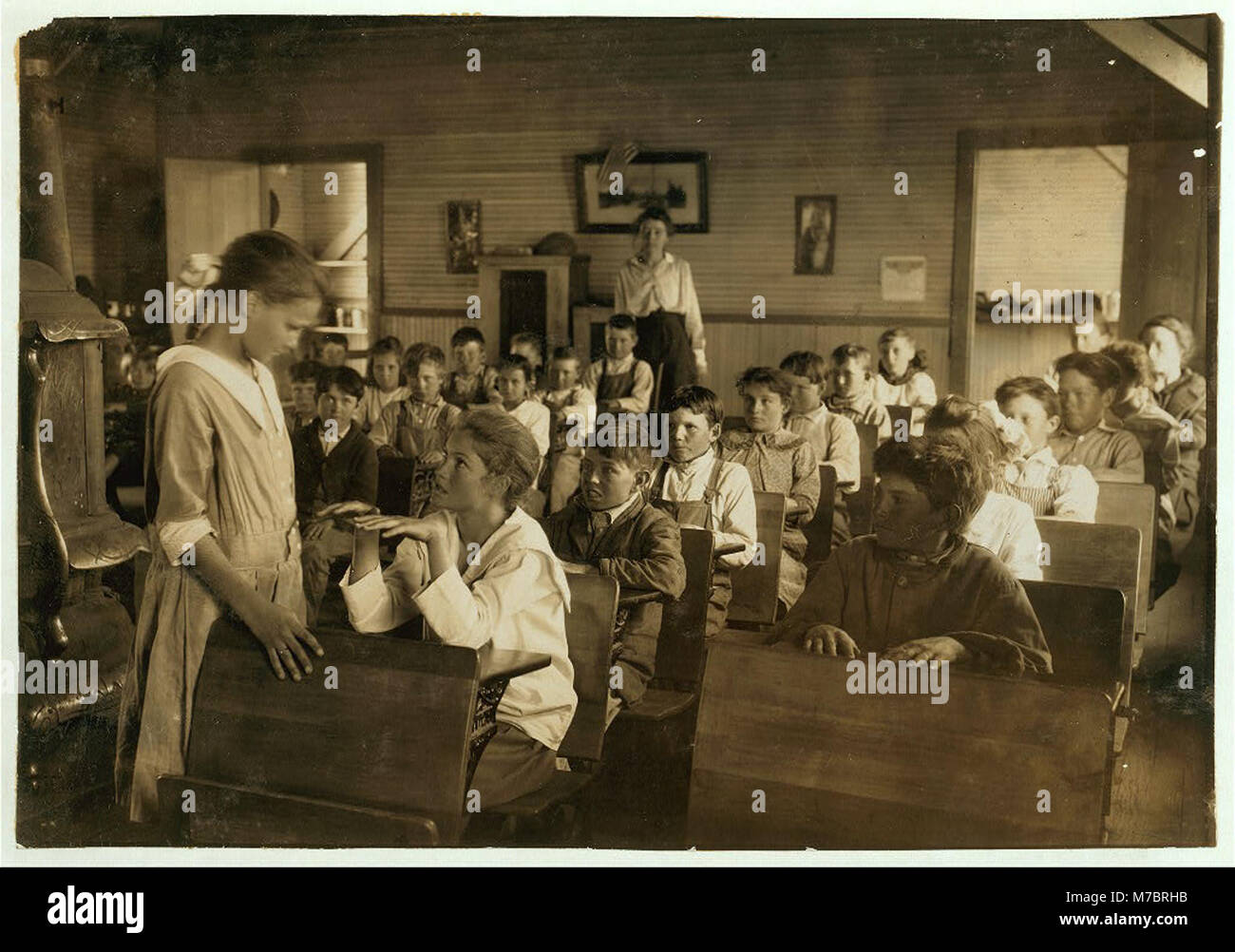 The image shows a daily inspection routine in a school where older ...