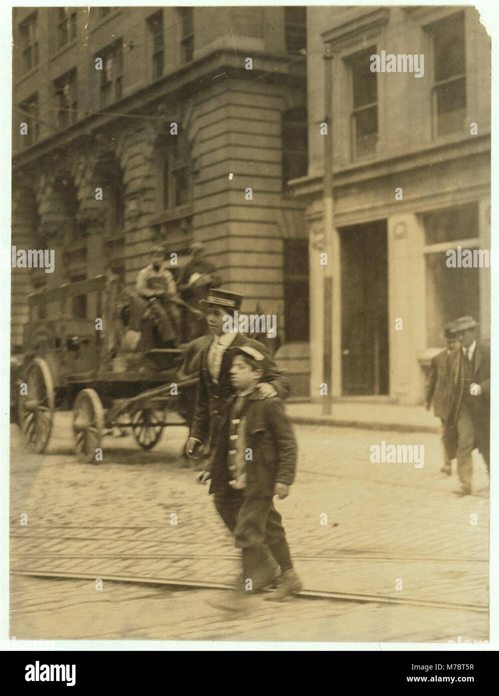 This photograph shows day messengers, likely from the early 20th ...