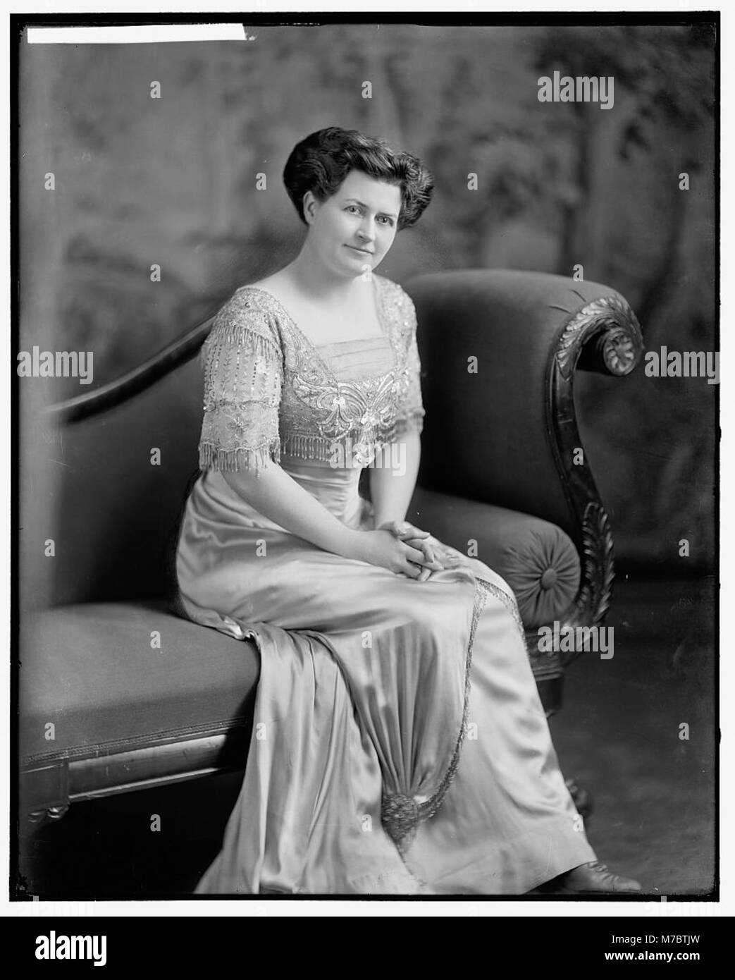 A formal portrait of Mrs. M. DeVries, identified through a historical ...