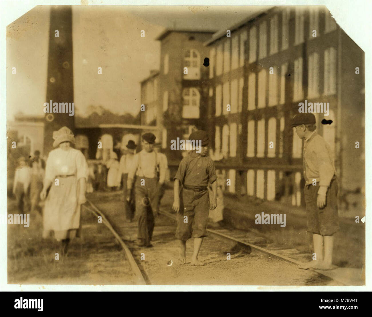 The photograph captures mill workers leaving Arkwright Mills in ...