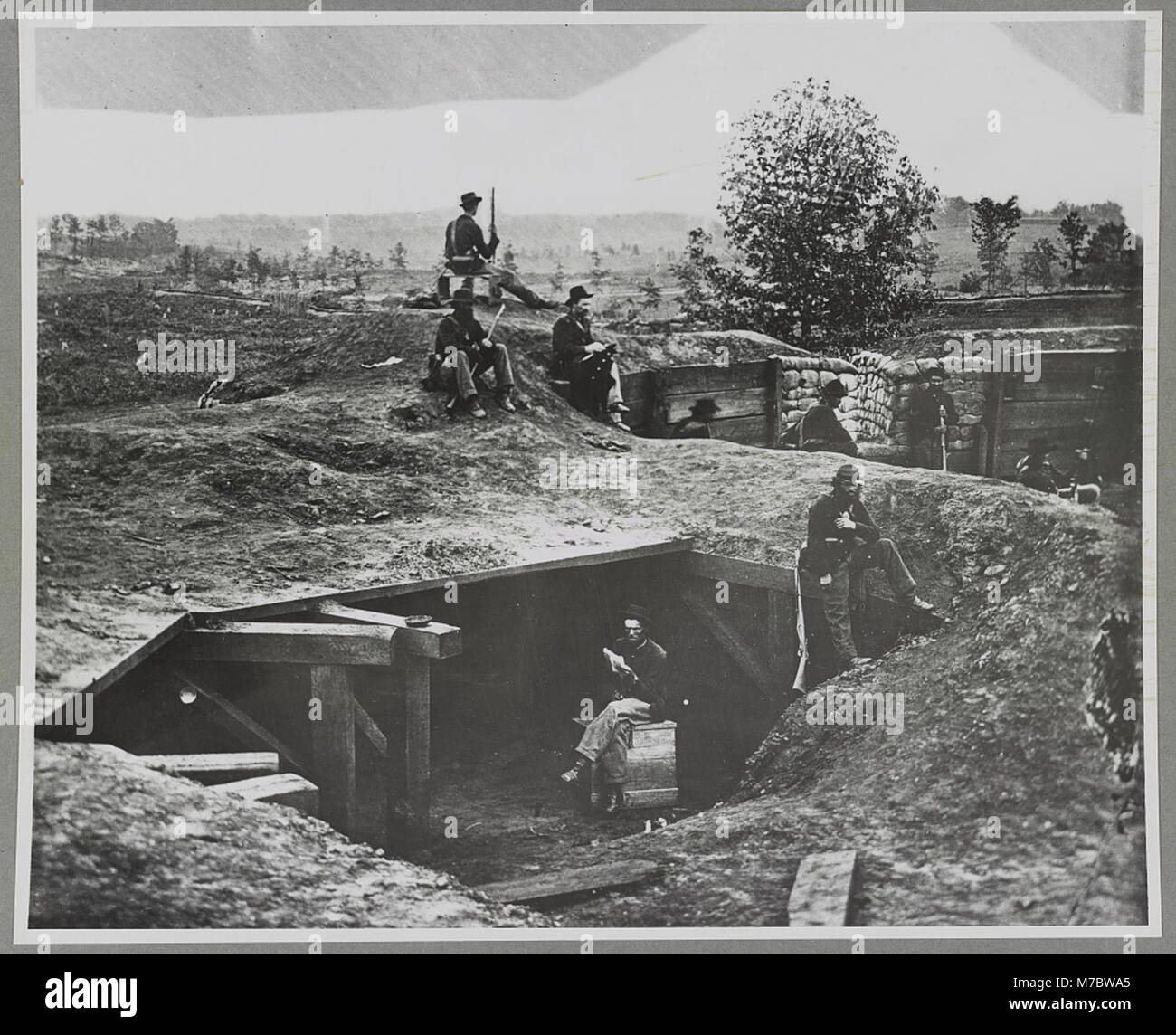 A photograph depicting a bomb-proof structure located in front of ...