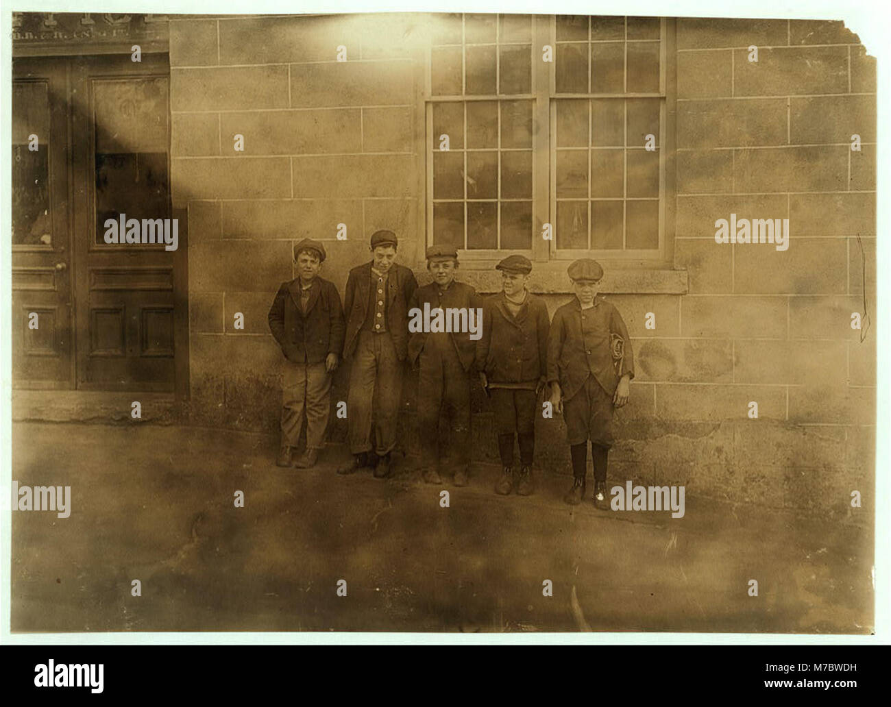 Small boys are shown working in the Natick Mills, Rhode Island, some of ...