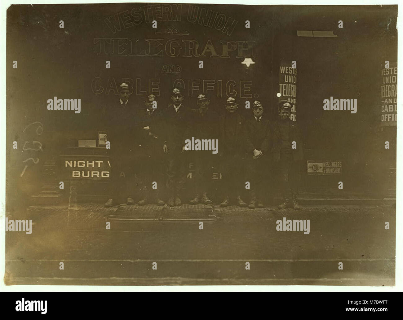 This photograph depicts a group of messenger boys, showing their role ...