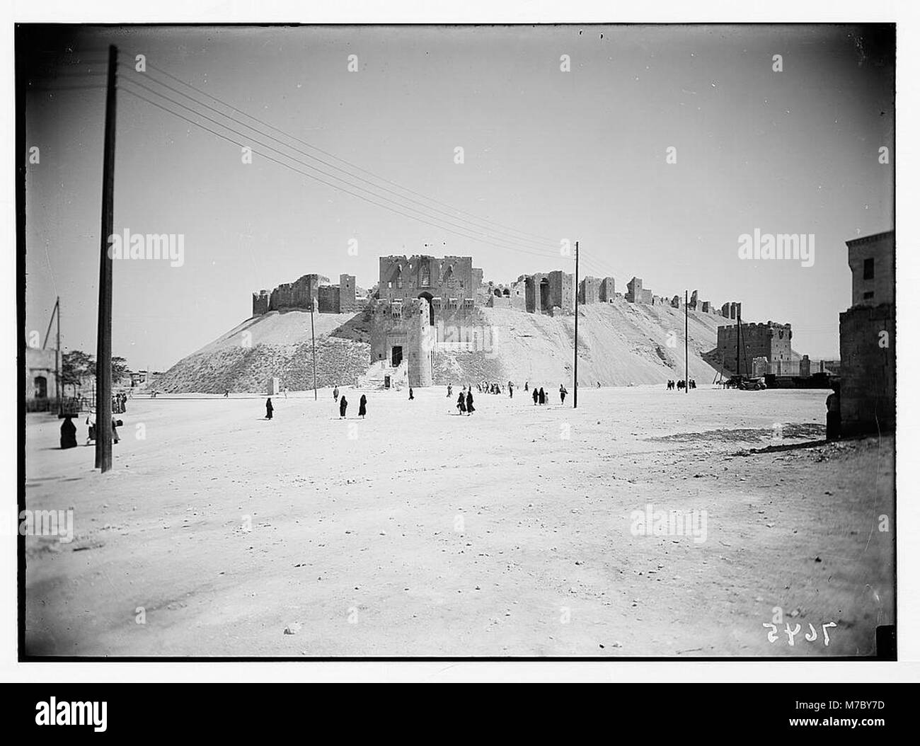 This photograph shows the Aleppo Castle, an ancient structure not of ...
