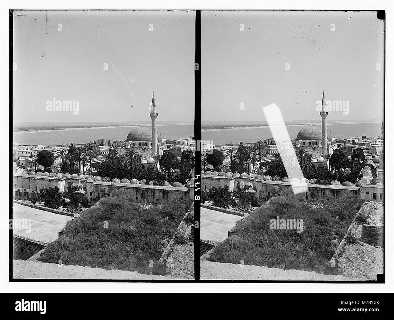 A photograph of the Mosque of Jezzar Pasha, located along the sea coast ...