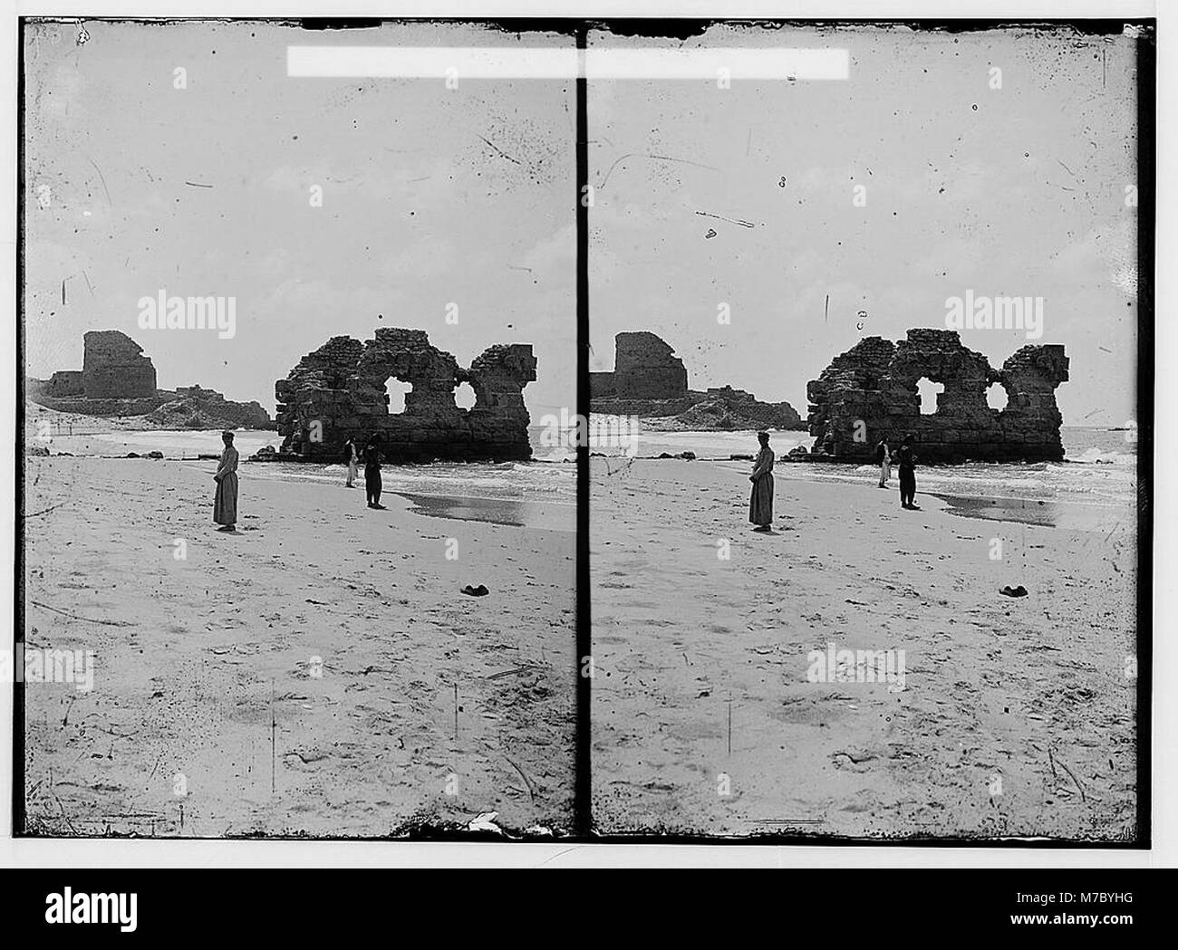 This image captures a view of the coastal town of Athlit from the beach ...