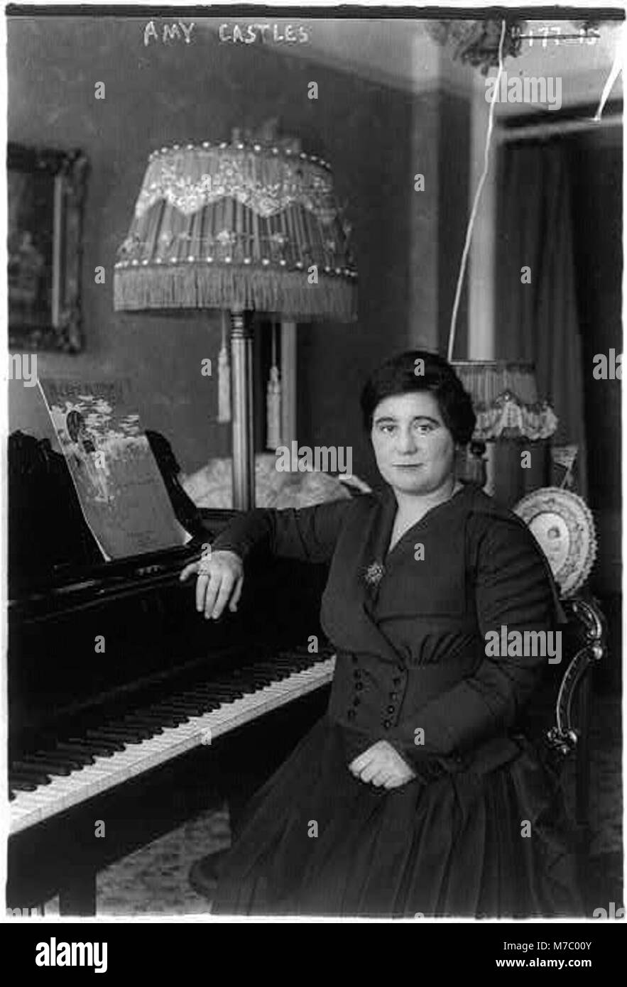 Amy Castles, an Australian singer, is captured in a three-quarters ...