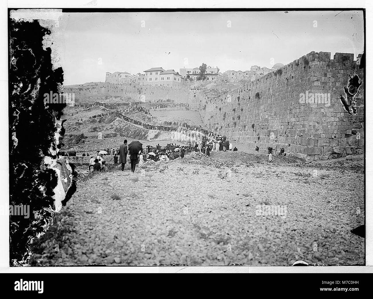 A photograph of an Arab religious procession, capturing a moment from a ...