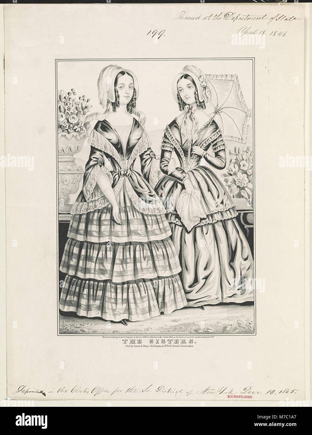 A photograph of two sisters, likely captured in a formal or casual ...