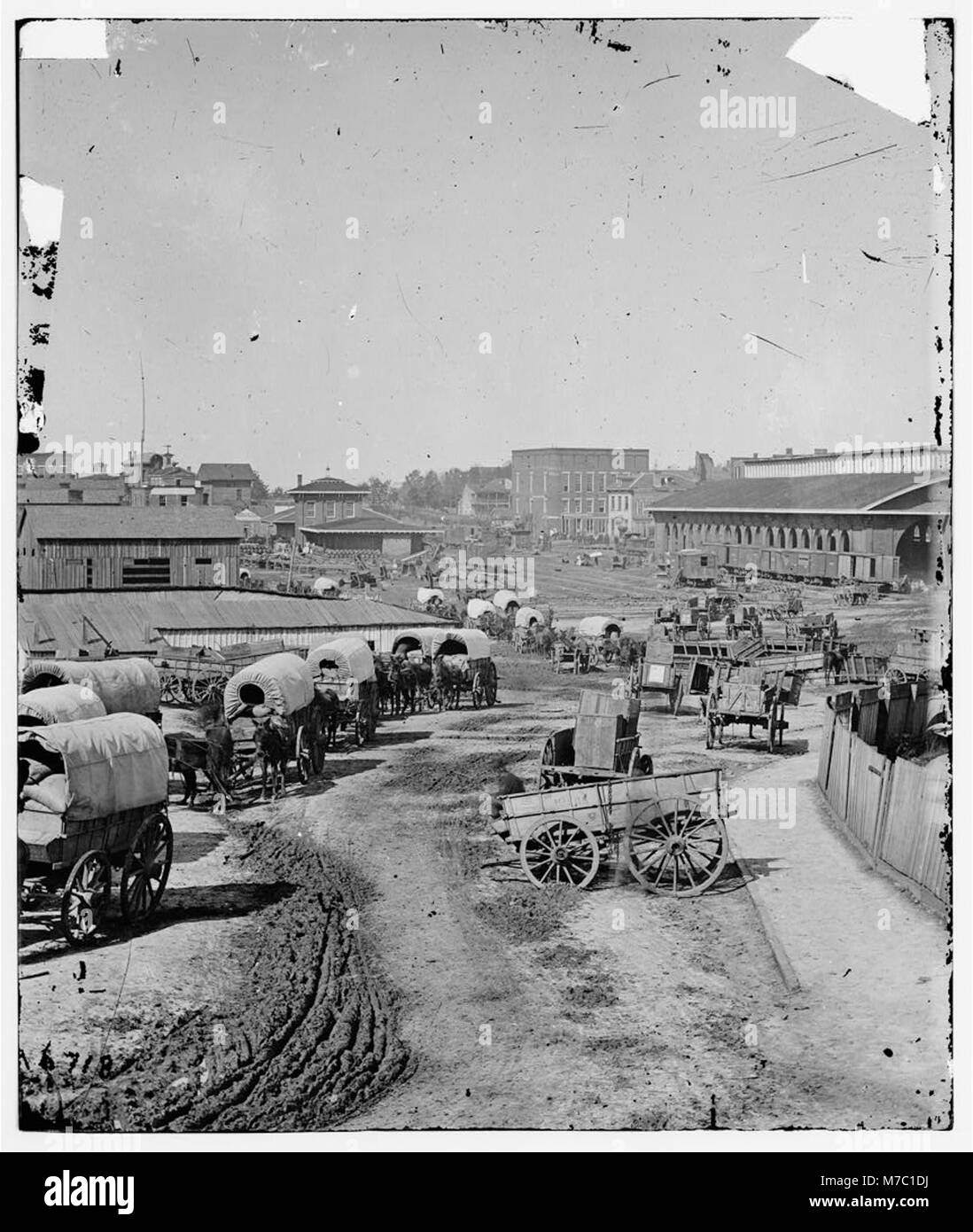 This historical image shows federal army wagons at a railroad depot in ...
