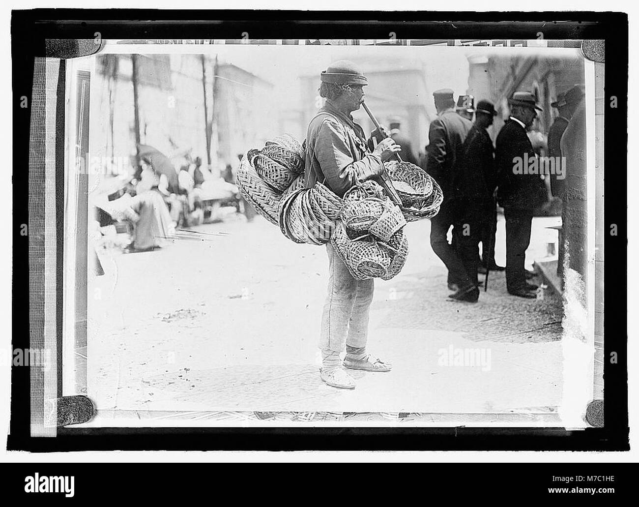 A photograph of Austria-Slovak peddlers in Trieste, showcasing a group ...
