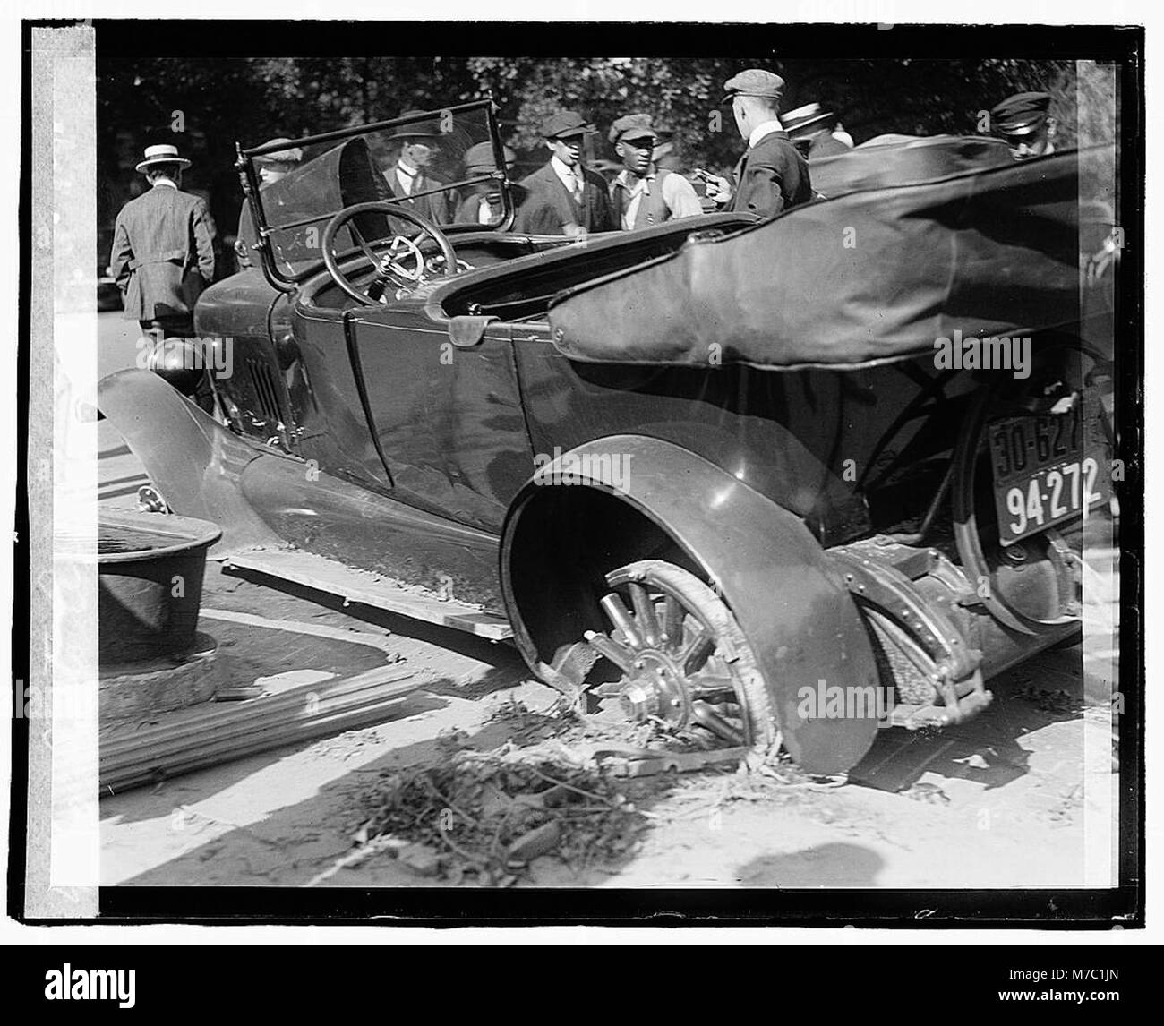 A photograph depicting an auto accident, showing the aftermath and ...