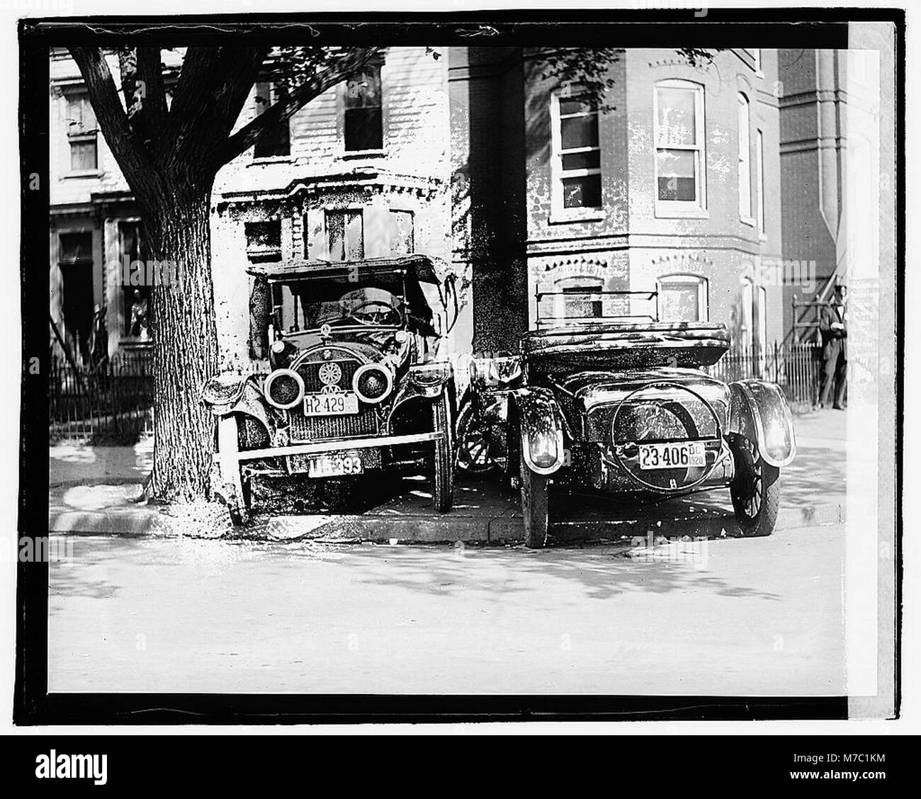 The photograph shows the aftermath of an automobile wreck, documenting ...