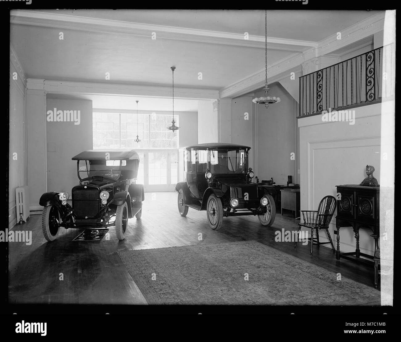 An automobile showroom captured in a historical photograph, showcasing ...