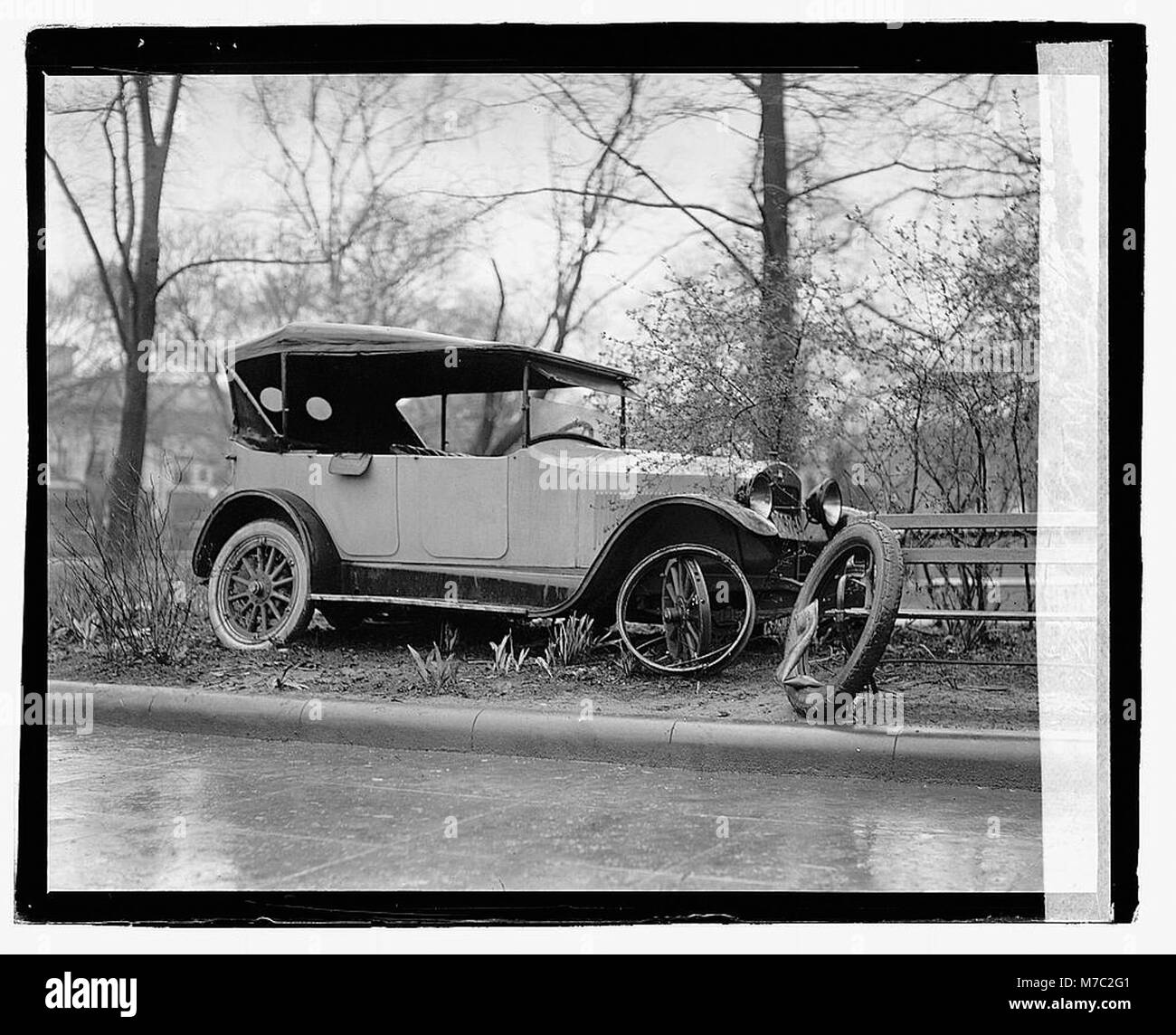 A photograph of a car wreck, highlighting the destruction and aftermath ...