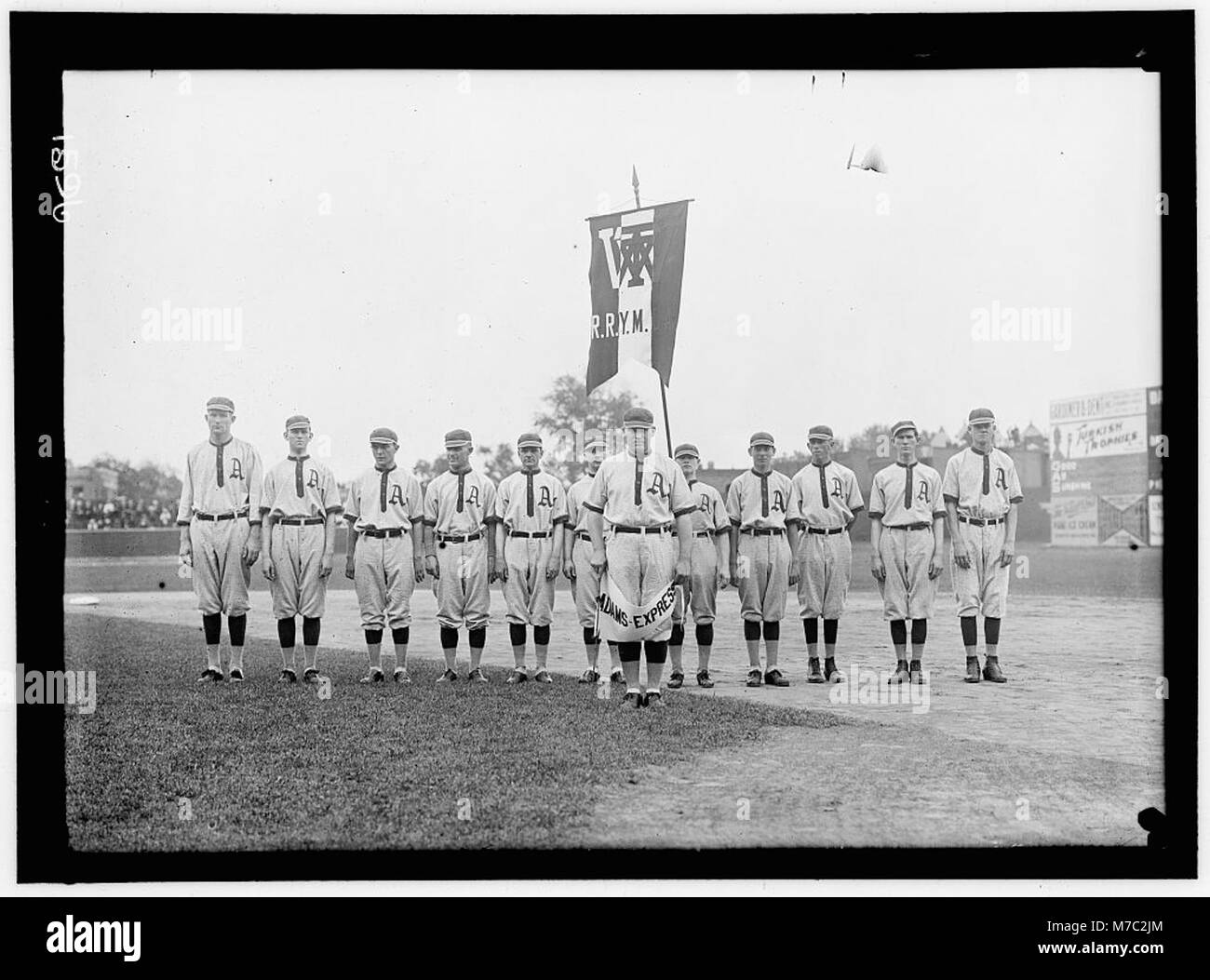 The image depicts an amateur baseball parade, showcasing participants ...