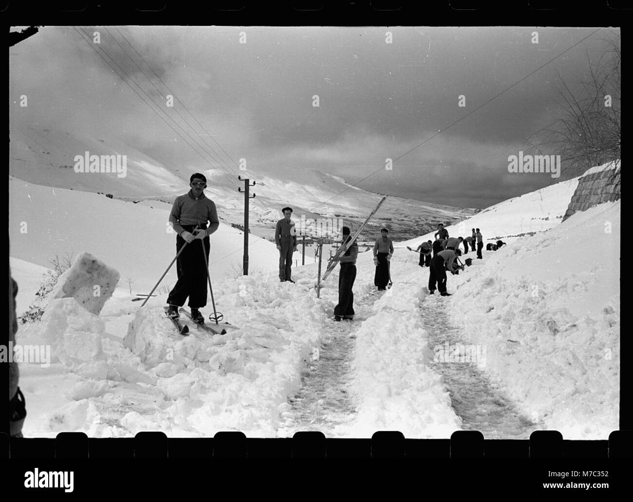 Lebanese soldiers clearing snow from a road in the Cedars region ...