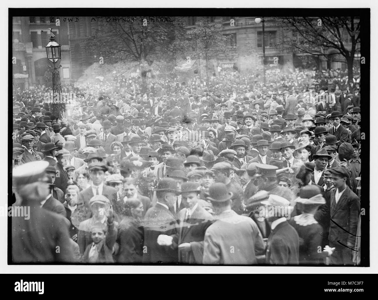 A crowd is shown attending the funeral of Gaynor, reflecting a moment ...