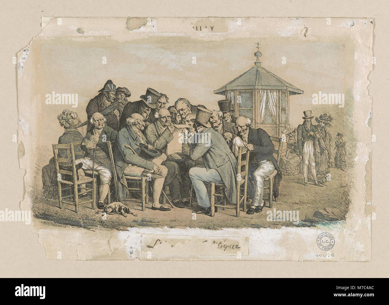 Photograph of a group of men gathered in a circle, engaged in ...