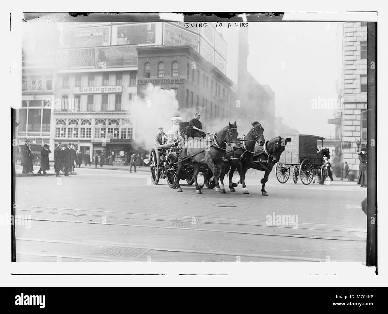 A dramatic photograph of individuals heading to a fire scene, capturing ...