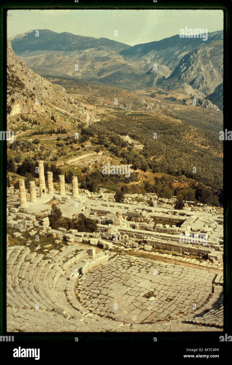 A photograph of the ancient Greek site of Delphi, featuring the theatre ...