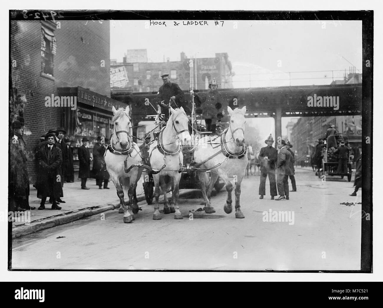 This image features a vintage hook and ladder fire truck, highlighting ...
